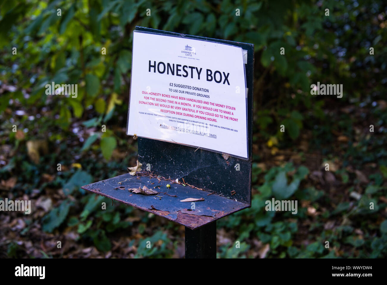 vandalised honesty box.at Chiddingstone castle, Kent.UK Stock Photo - Alamy