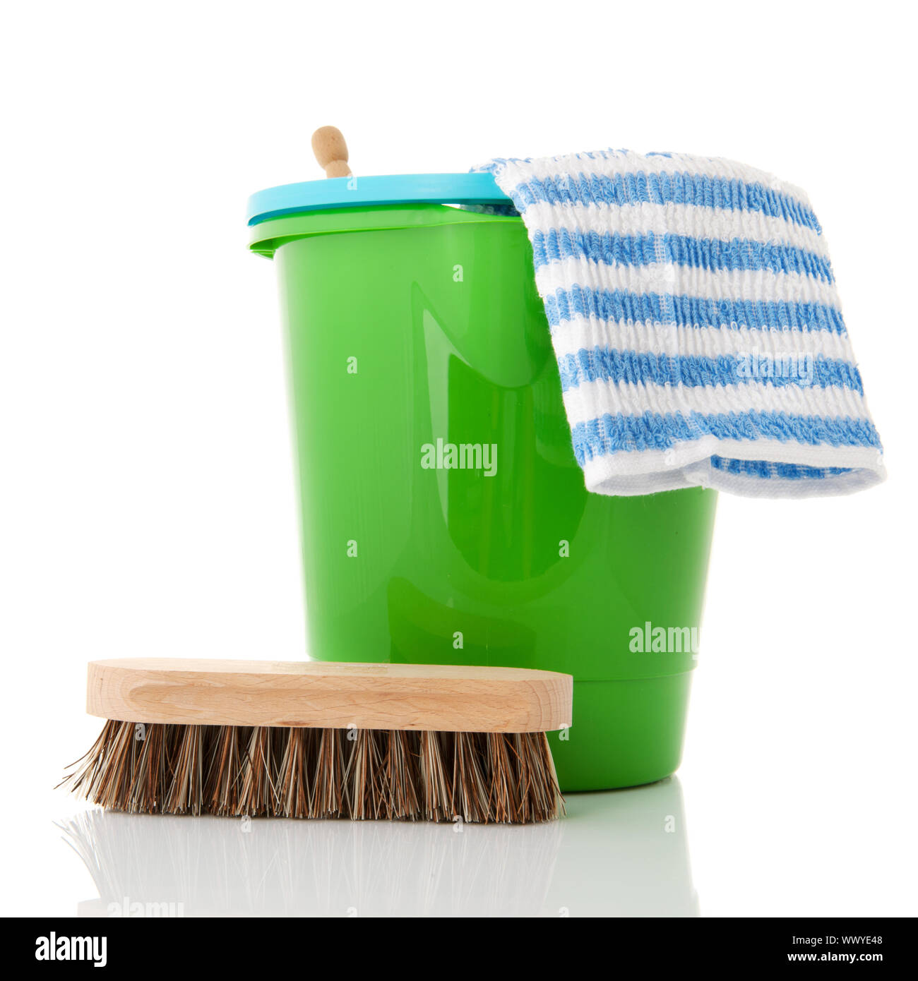 Green bucket scrobbing brush and cloth isolated over white background ...