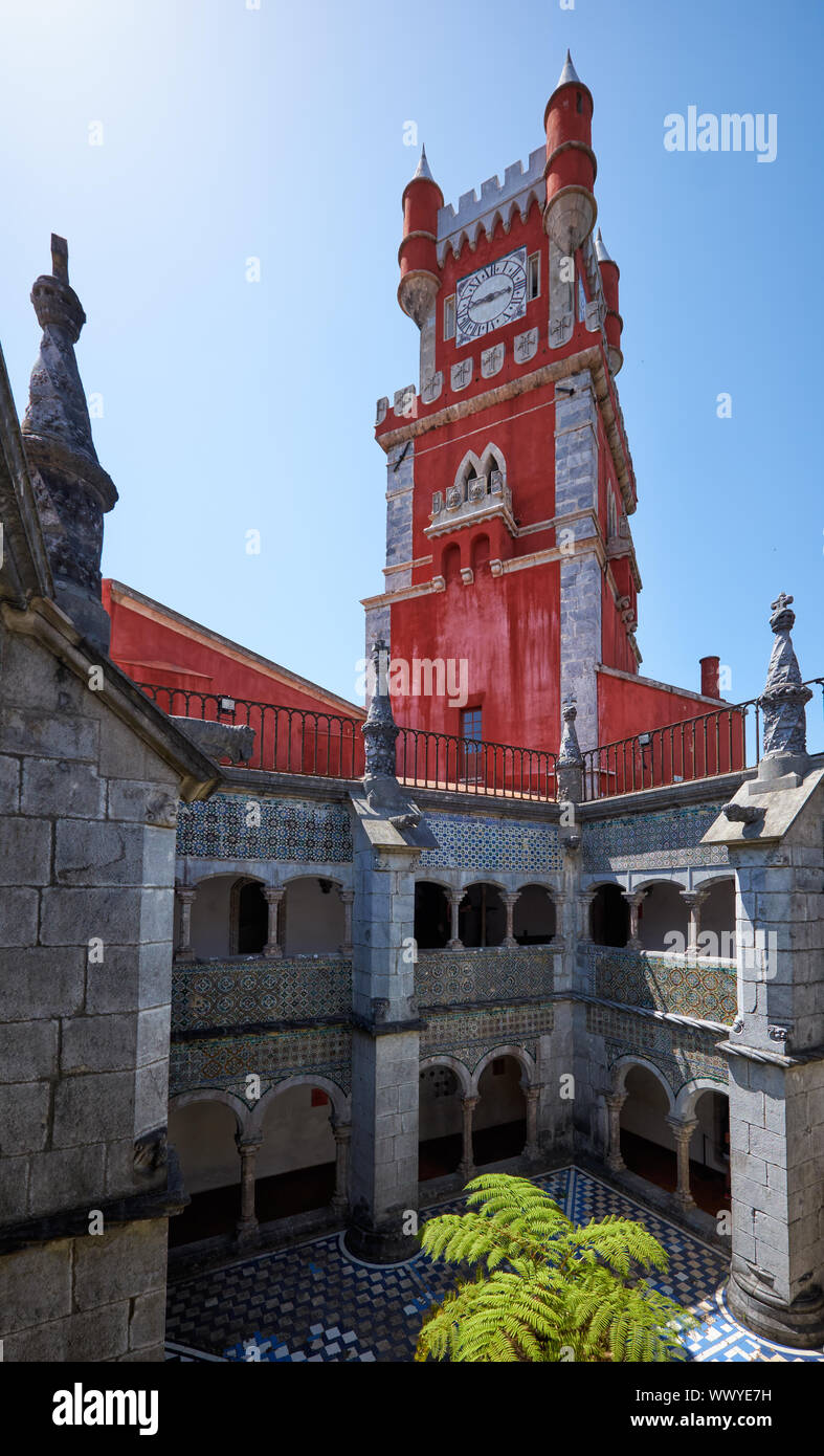 Clock tower and the cloisters of monastery in the Pena Palace. Sintra ...