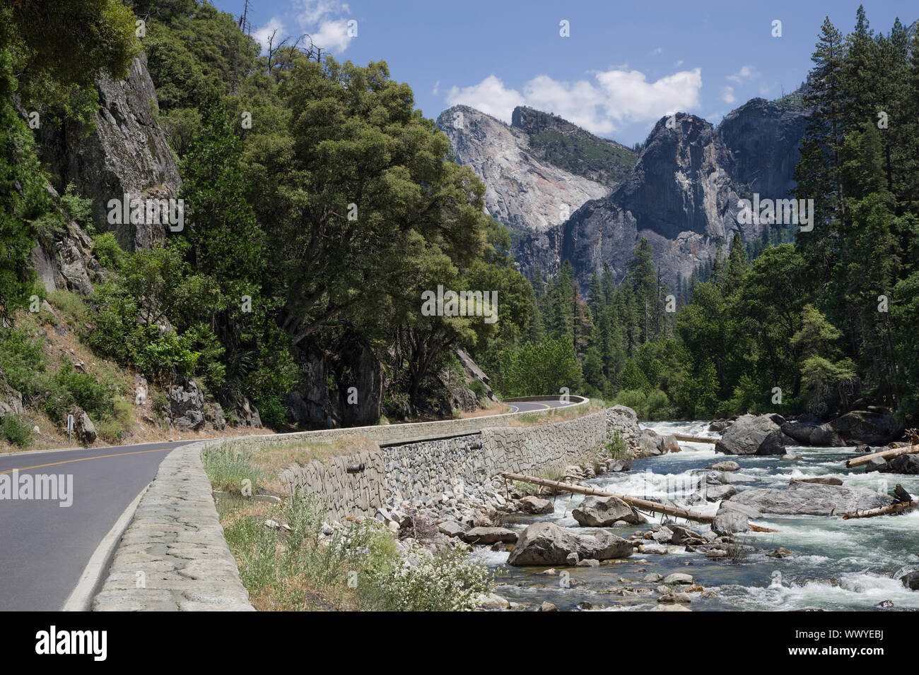Yosemite Park Scenic Drive: A Sierra Nevada mountain road curves beside ...
