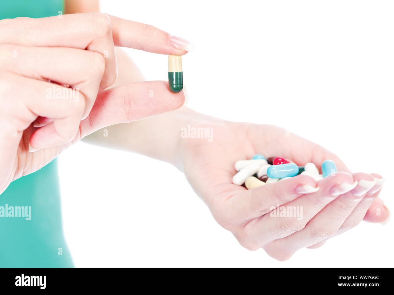capsules in woman's hand, isolated on white Stock Photo - Alamy