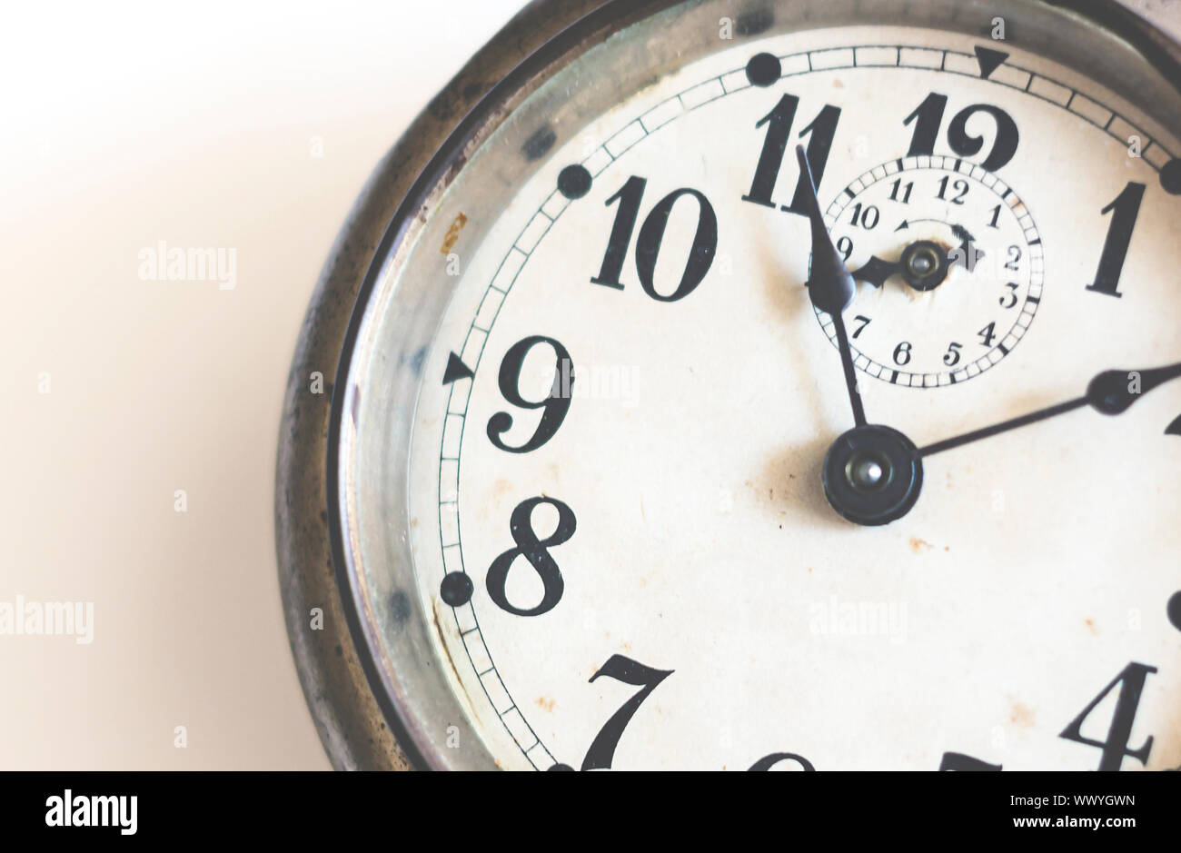 old analog clock with hands and numbers. Analog metal alarm clock ...