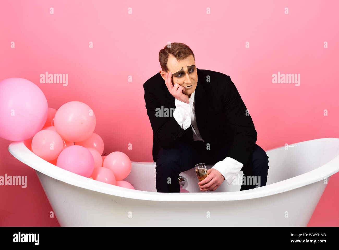 Think celebration, think champagne. Mime actor has celebration party ...