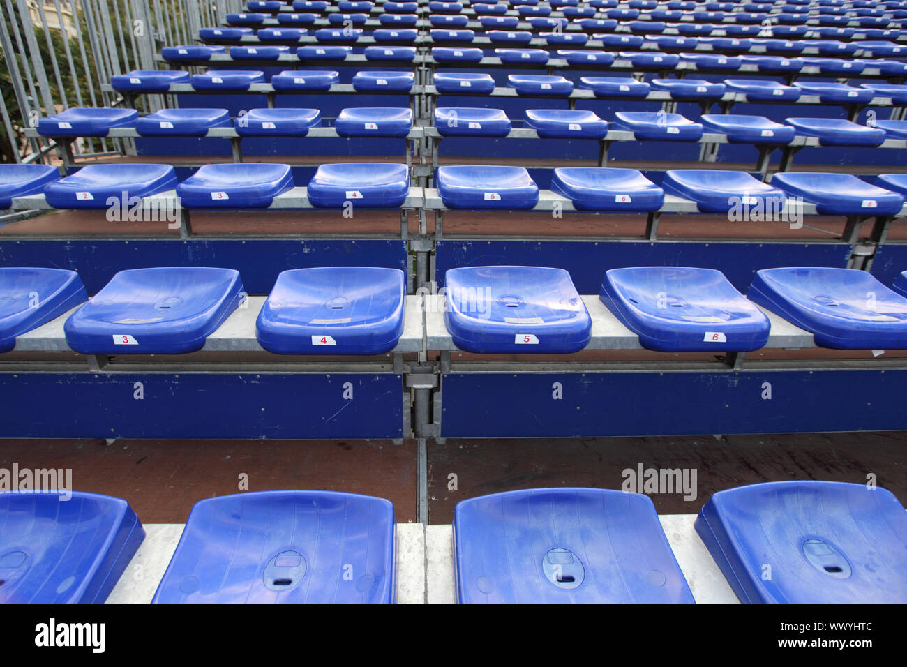 many blue and yellow vip seat in football stadium Stock Photo - Alamy