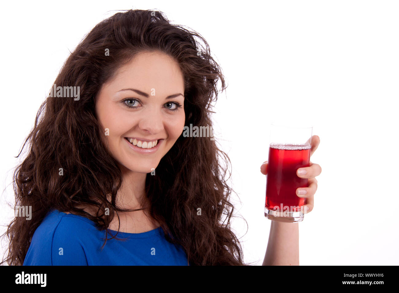 beautiful smiling brunette woman is drinking red juice isolated on ...
