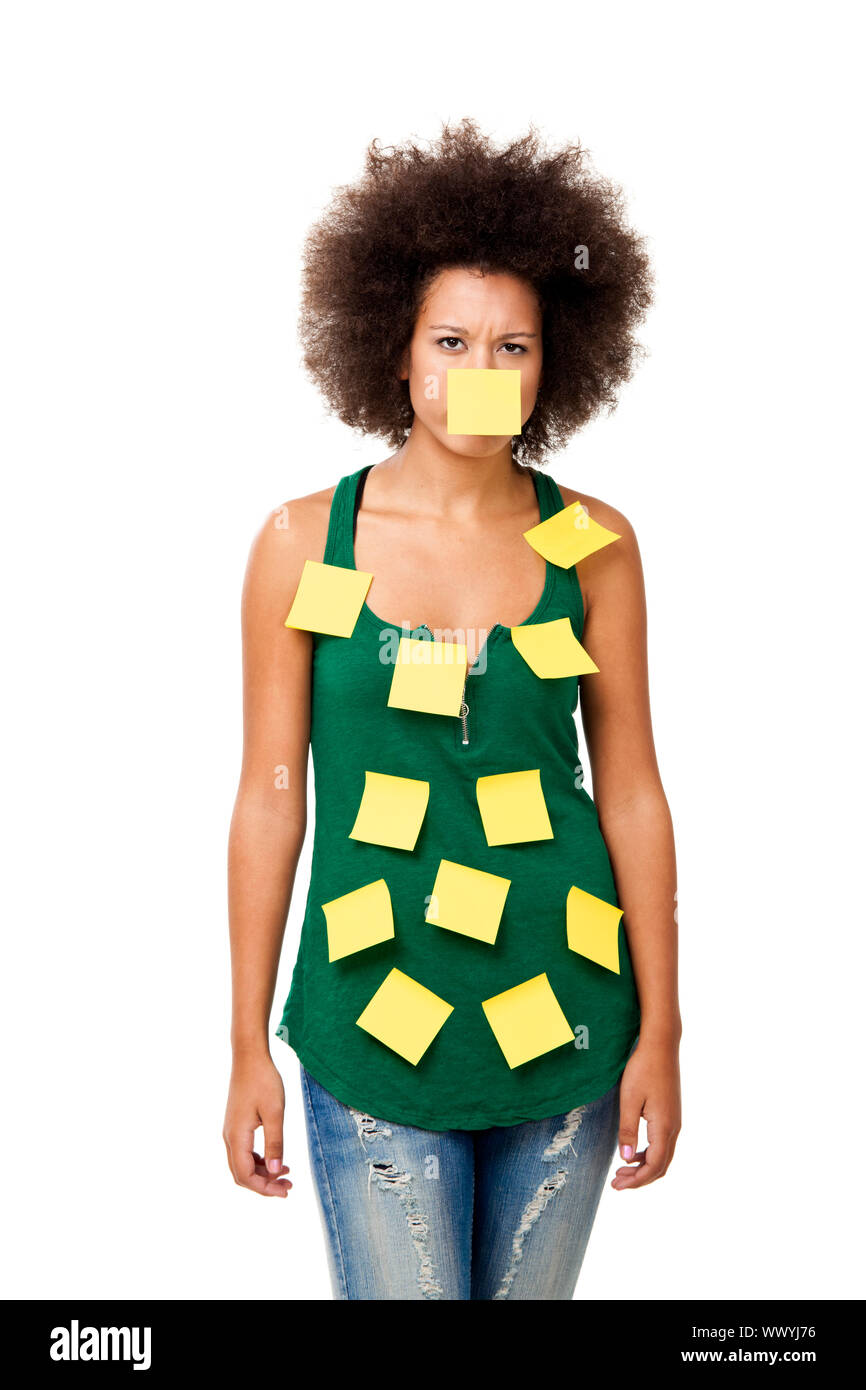 Beautiful young woman covered with post it notes all over the body ...