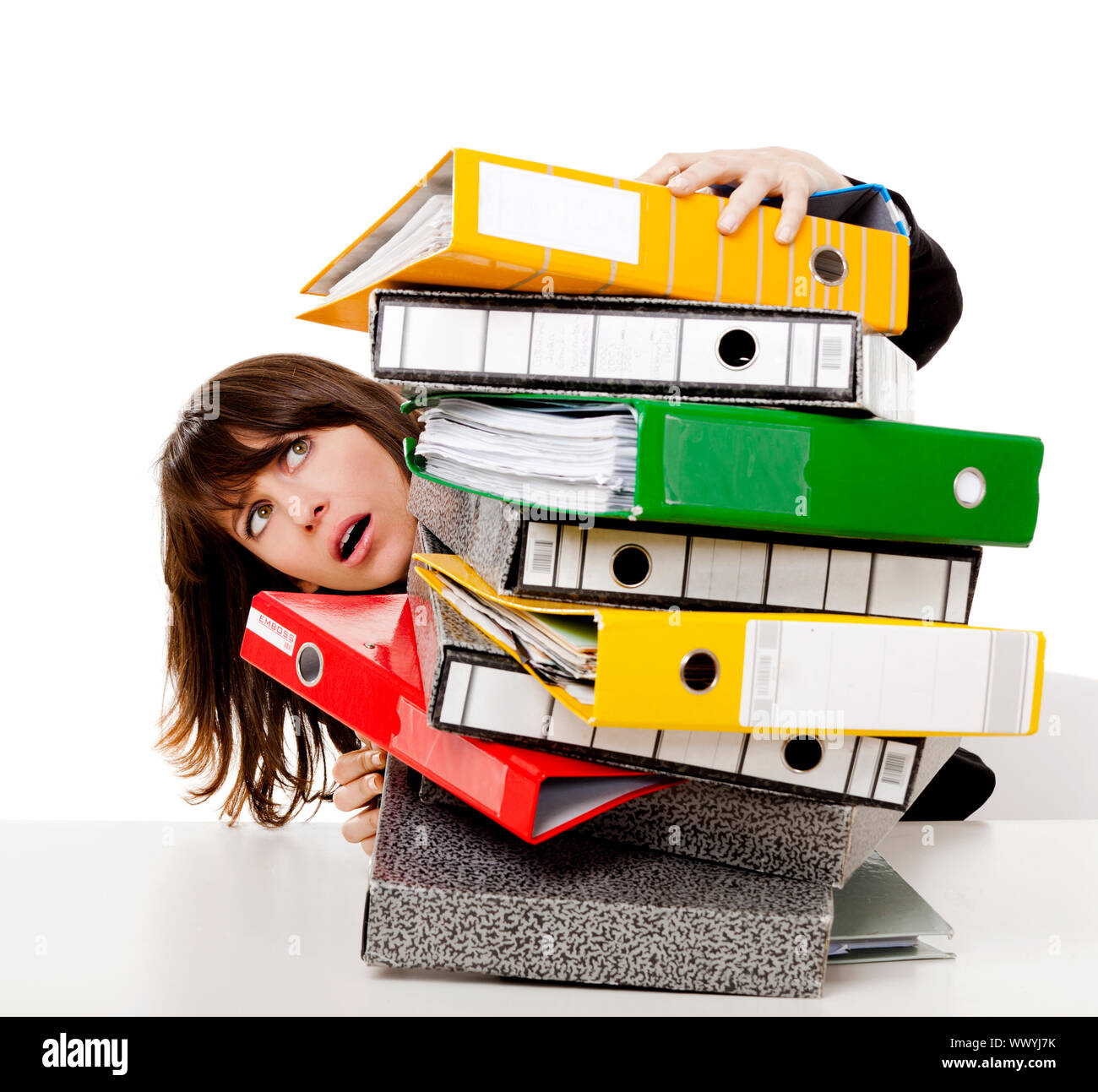 Business woman in the office embracing a pile of folders, isolated on ...