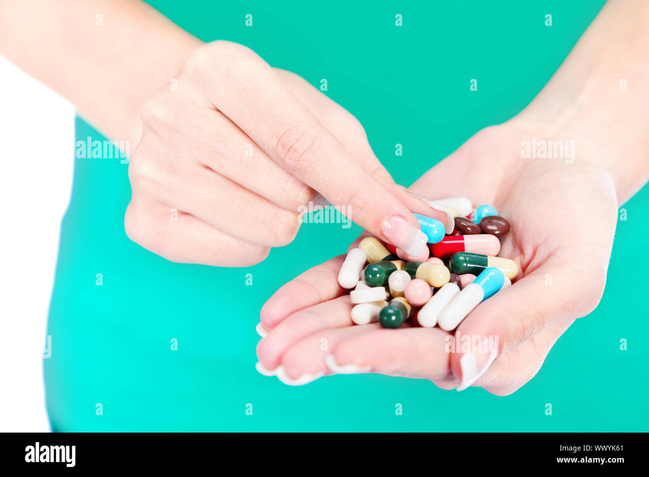 capsules in woman's hand, isolated on white Stock Photo - Alamy