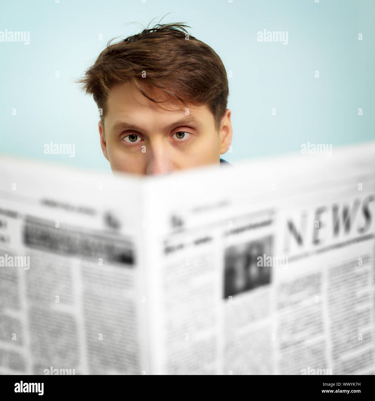 Mature man reads news on hi-res stock photography and images - Alamy