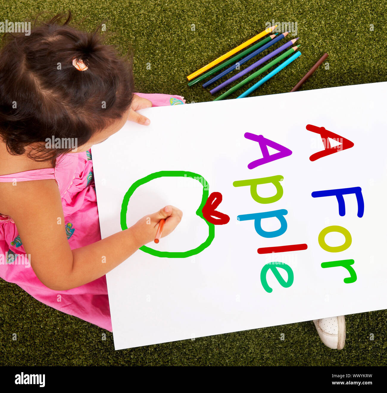 Girl Writing Apple Shows Kid Learning The Alphabet Stock Photo - Alamy