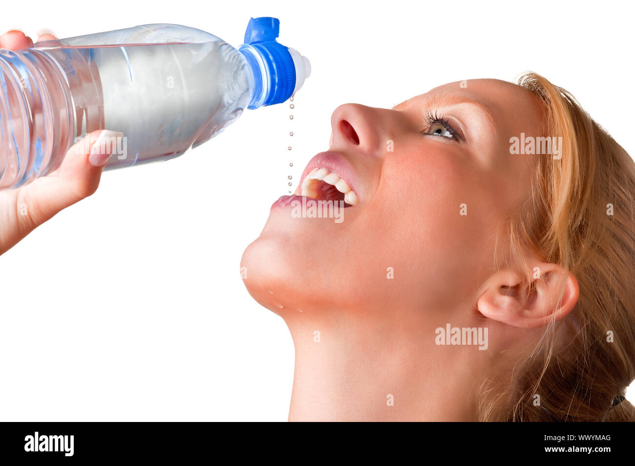 Woman drinking water from a plastic bottle, drops of water falling to ...