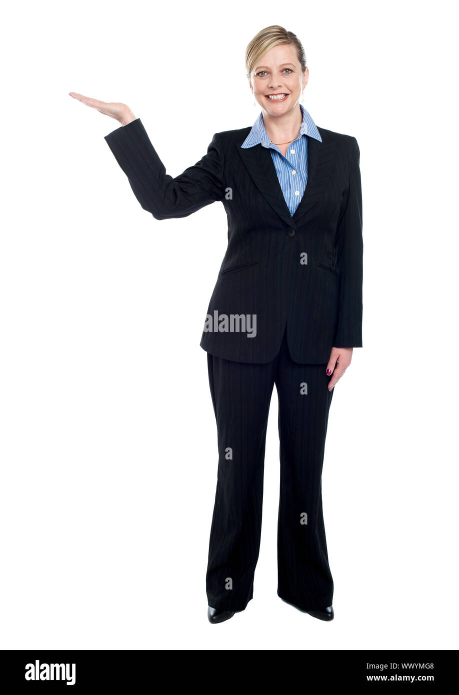 Smiling corporate lady presenting copy space, full length portrait ...