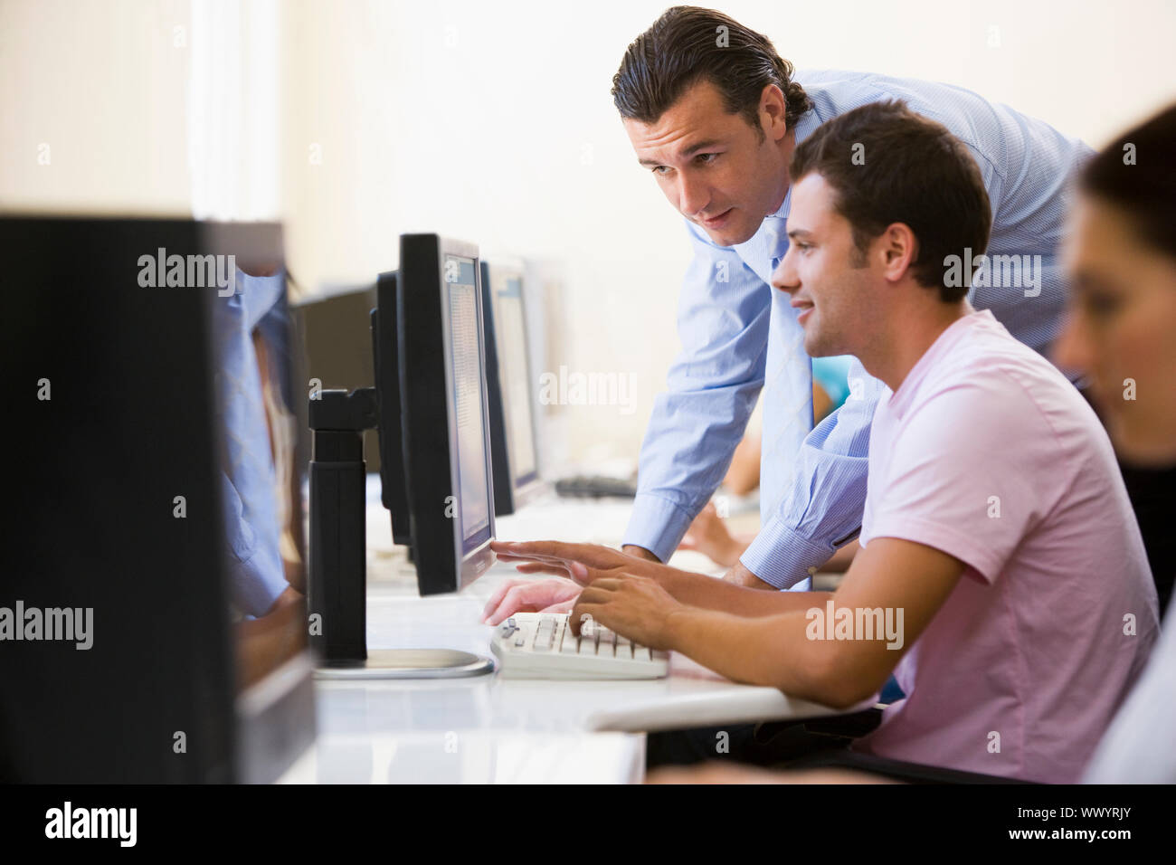 Manager helping staff in busy hi-res stock photography and images - Alamy