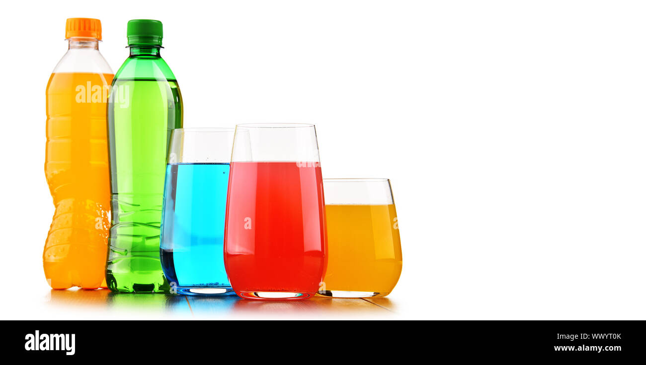 Glasses and bottles of assorted carbonated soft drinks isolated on ...