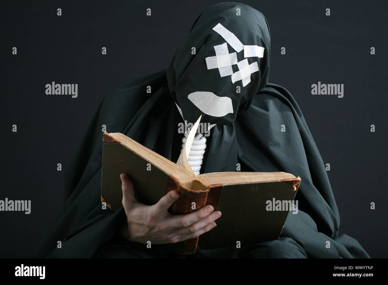 black mime reading a book Stock Photo - Alamy