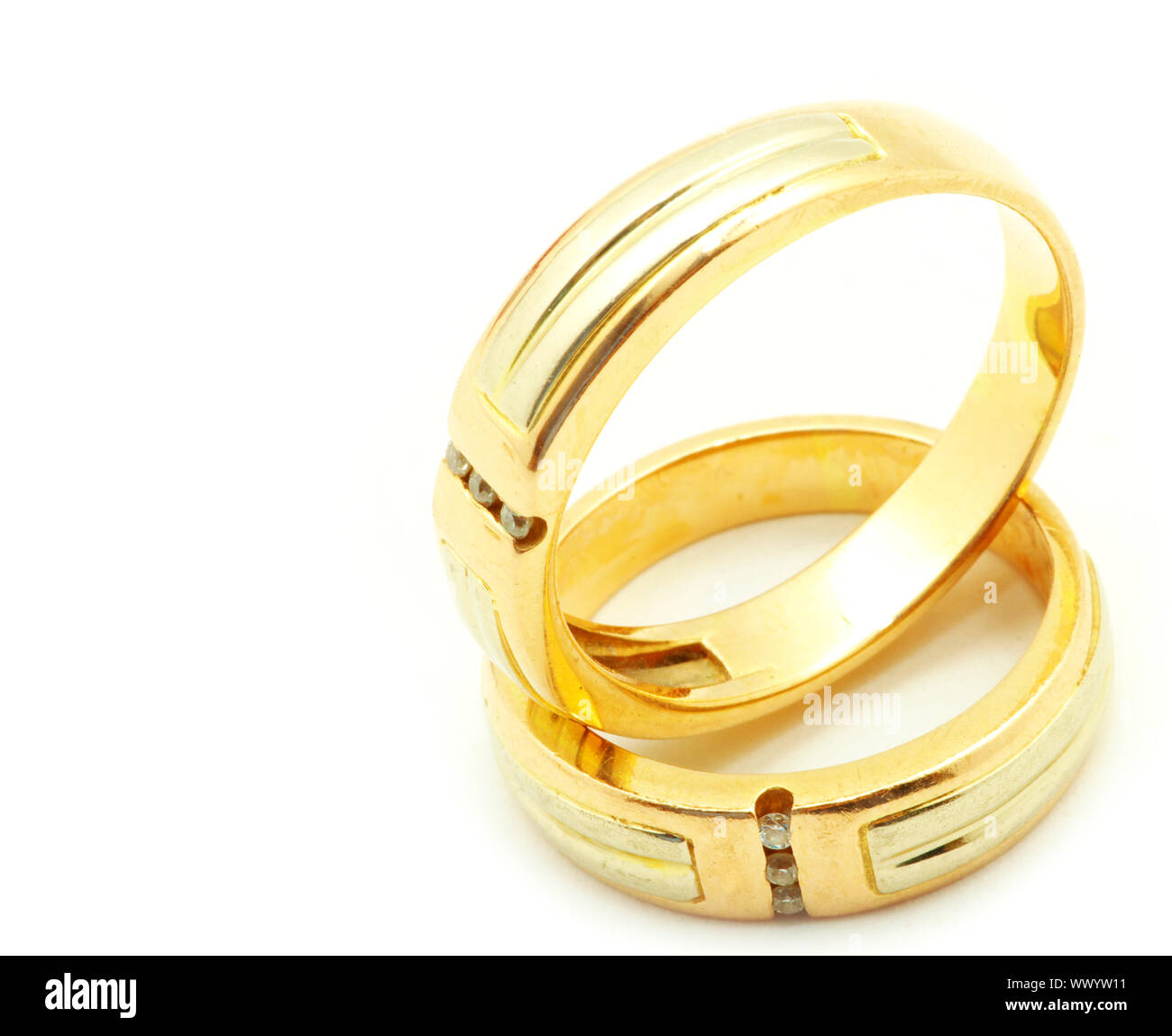 Gold wedding rings isolated on white background Stock Photo - Alamy