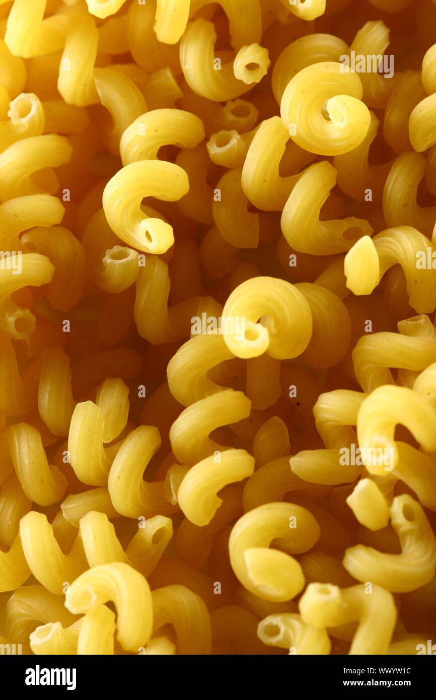 macro Macaroni yellow food background Stock Photo - Alamy