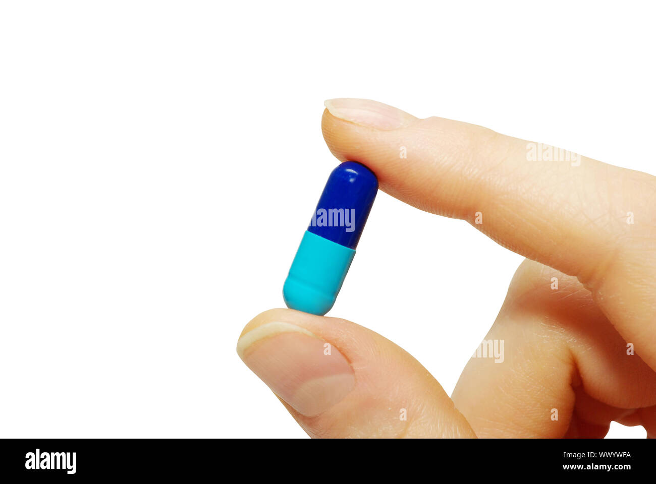 finger holds pill isolated on white Stock Photo - Alamy