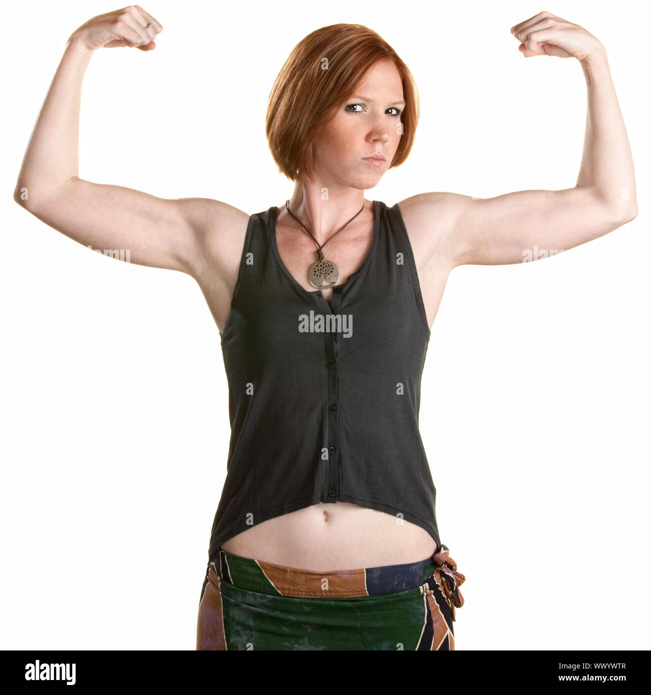 Serious Caucasian woman flexing biceps over white background Stock Photo - Alamy