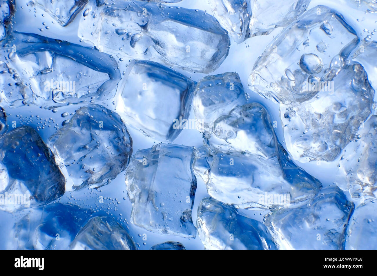 macro of ice cubes in a blue bin Stock Photo - Alamy