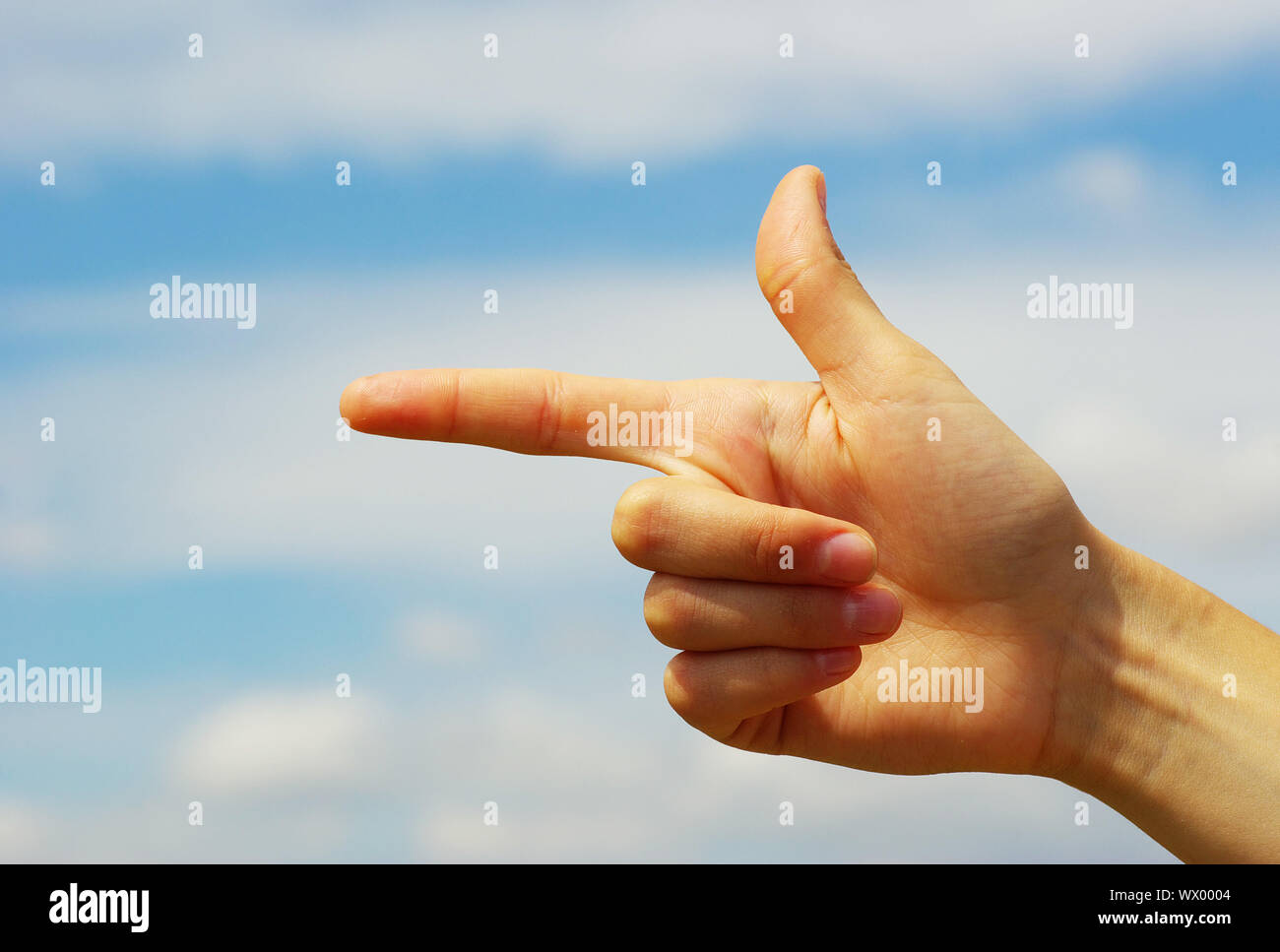 hand pointing with index finger against a white background Stock Photo ...