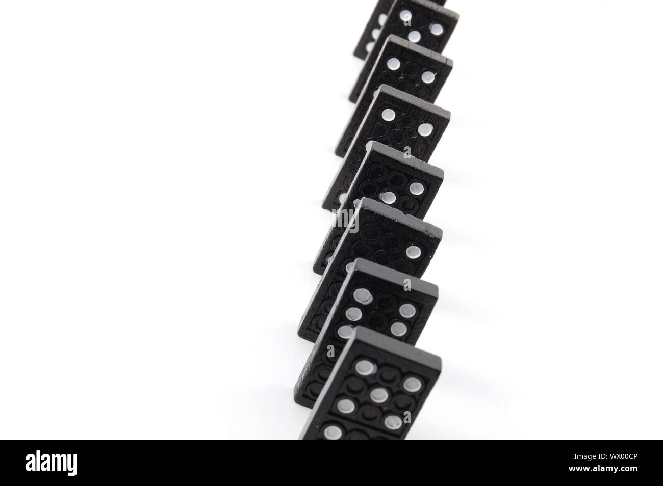 chain of dominoes isolated on a white background Stock Photo - Alamy