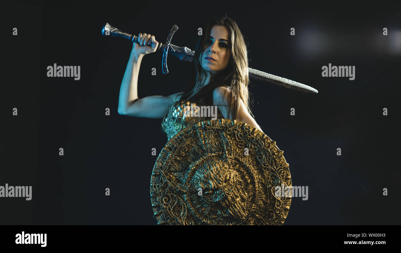 valkyrie warrior, woman with golden armor iron coat and big warrior ...