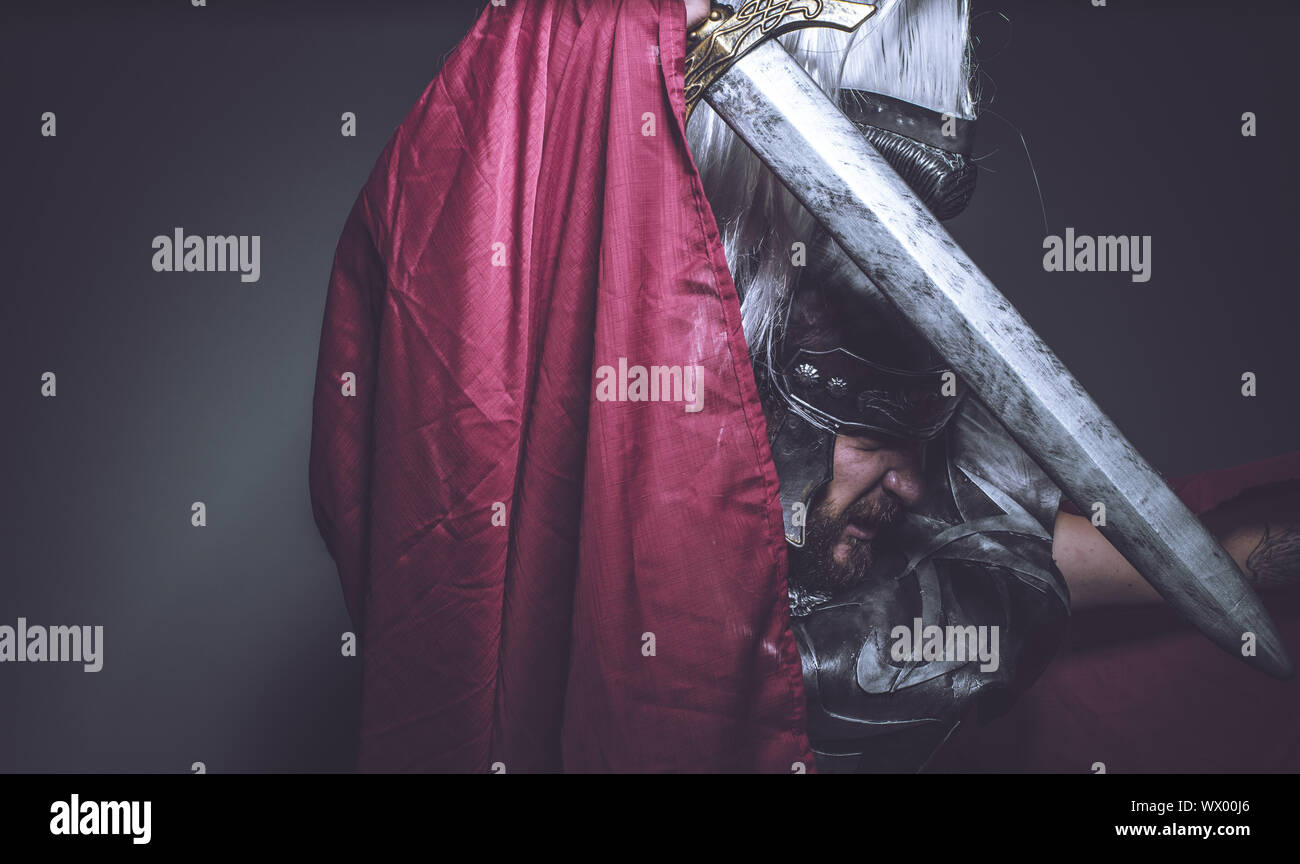 Roman gladiator, wrestler and warrior of Rome with helmet and red cloak ...