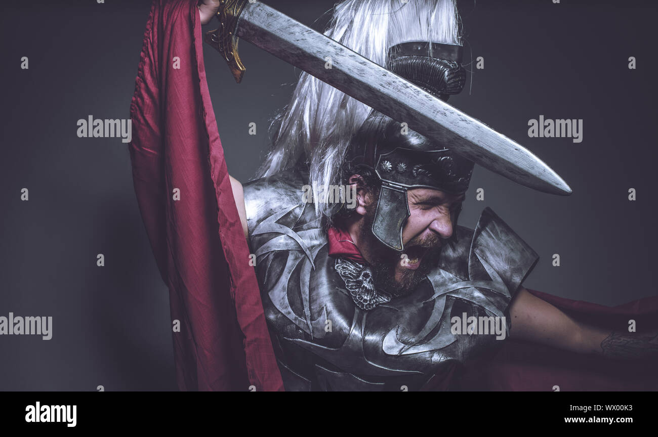 Roman gladiator, wrestler and warrior of Rome with helmet and red cloak ...