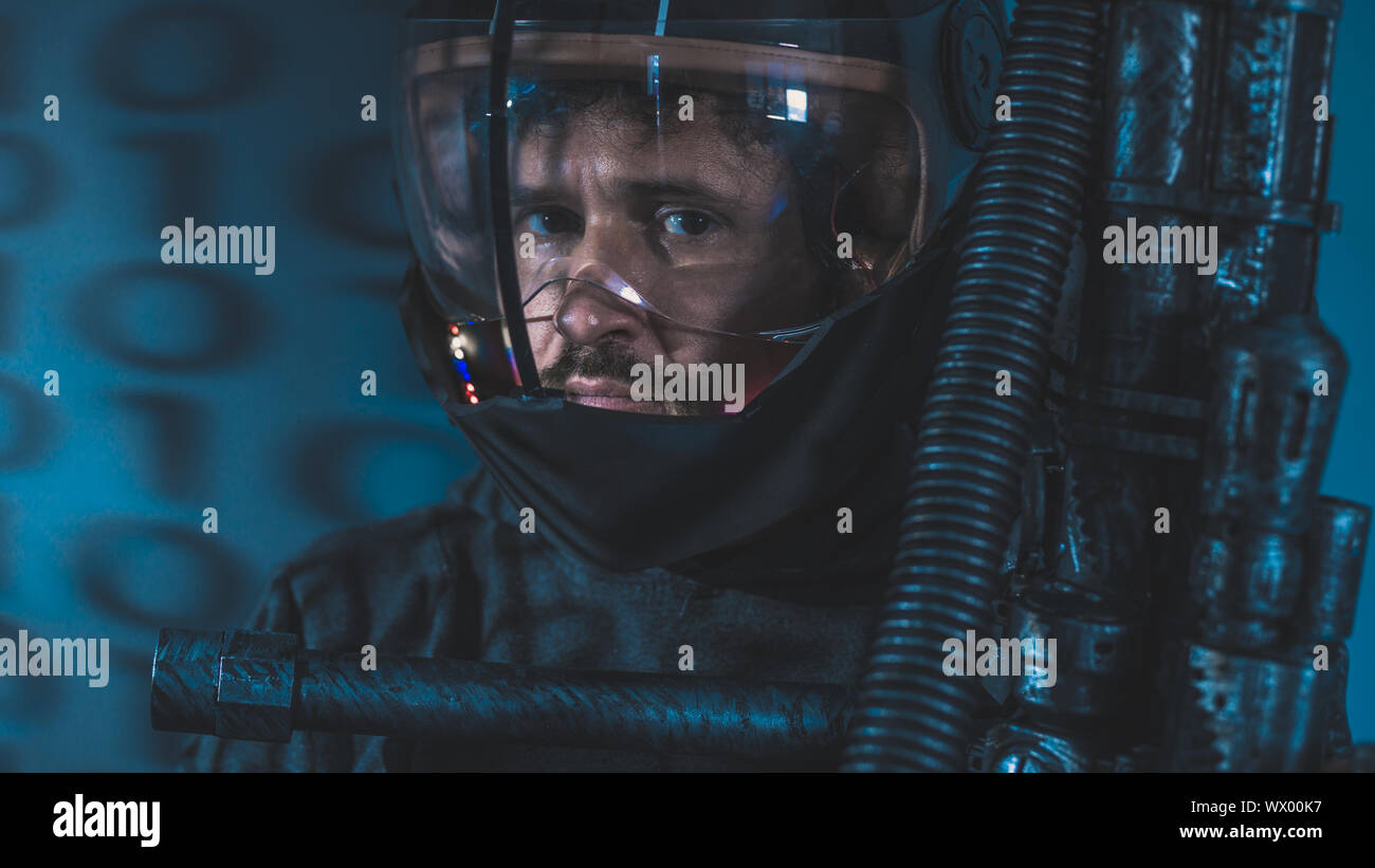 Astronaut, space man with led lights helmet, space suit and gun in the ...