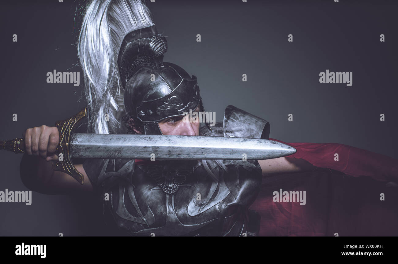 Roman gladiator, wrestler and warrior of Rome with helmet and red cloak ...