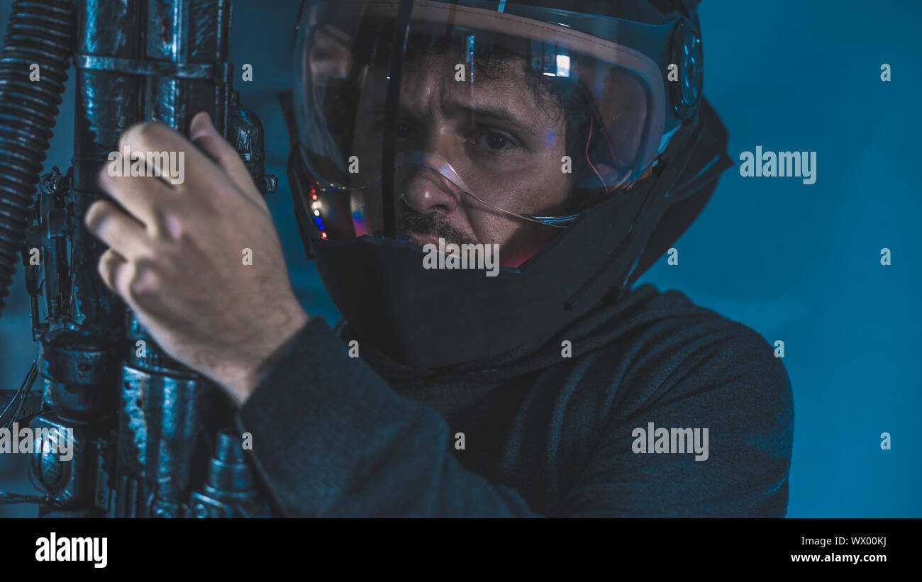 space man with led lights helmet, space suit and gun in the shape of a ...
