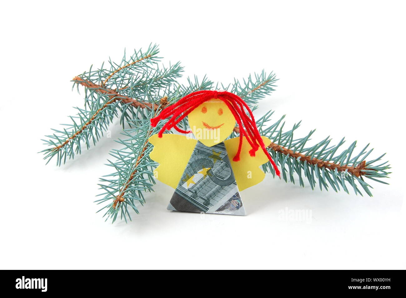 Angel made of money isolated on white background Stock Photo - Alamy