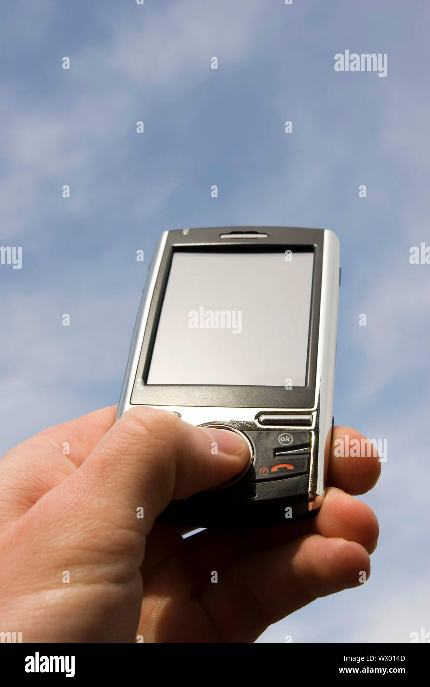hands with communicator isolated over blue background Stock Photo - Alamy
