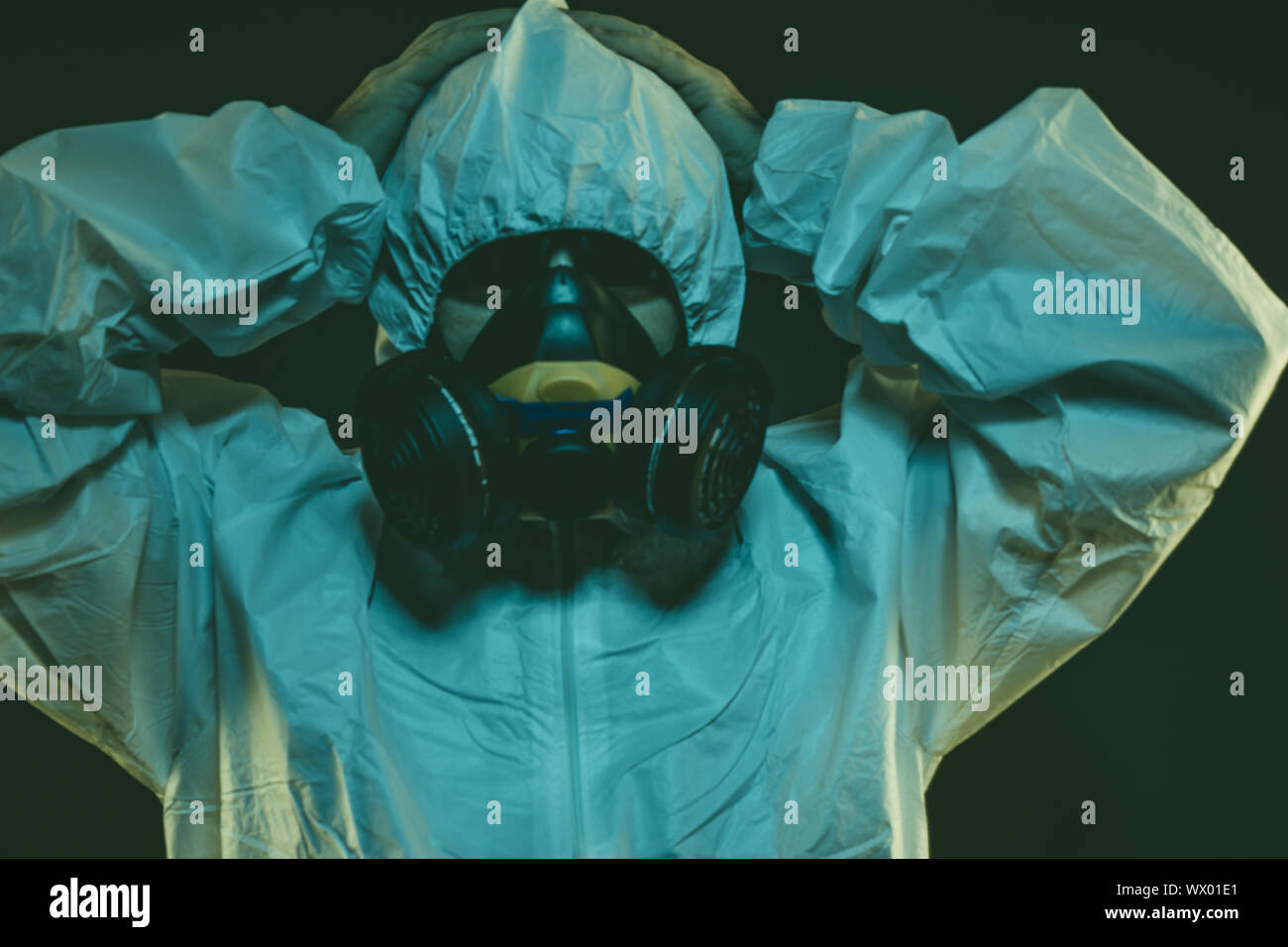 virus infection concept. Man in protective suit and antigas mask with ...