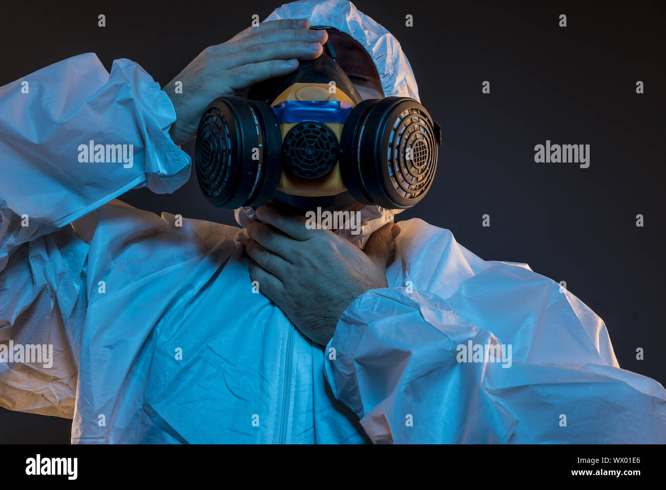 Safety virus infection concept. Man in protective suit and antigas mask ...