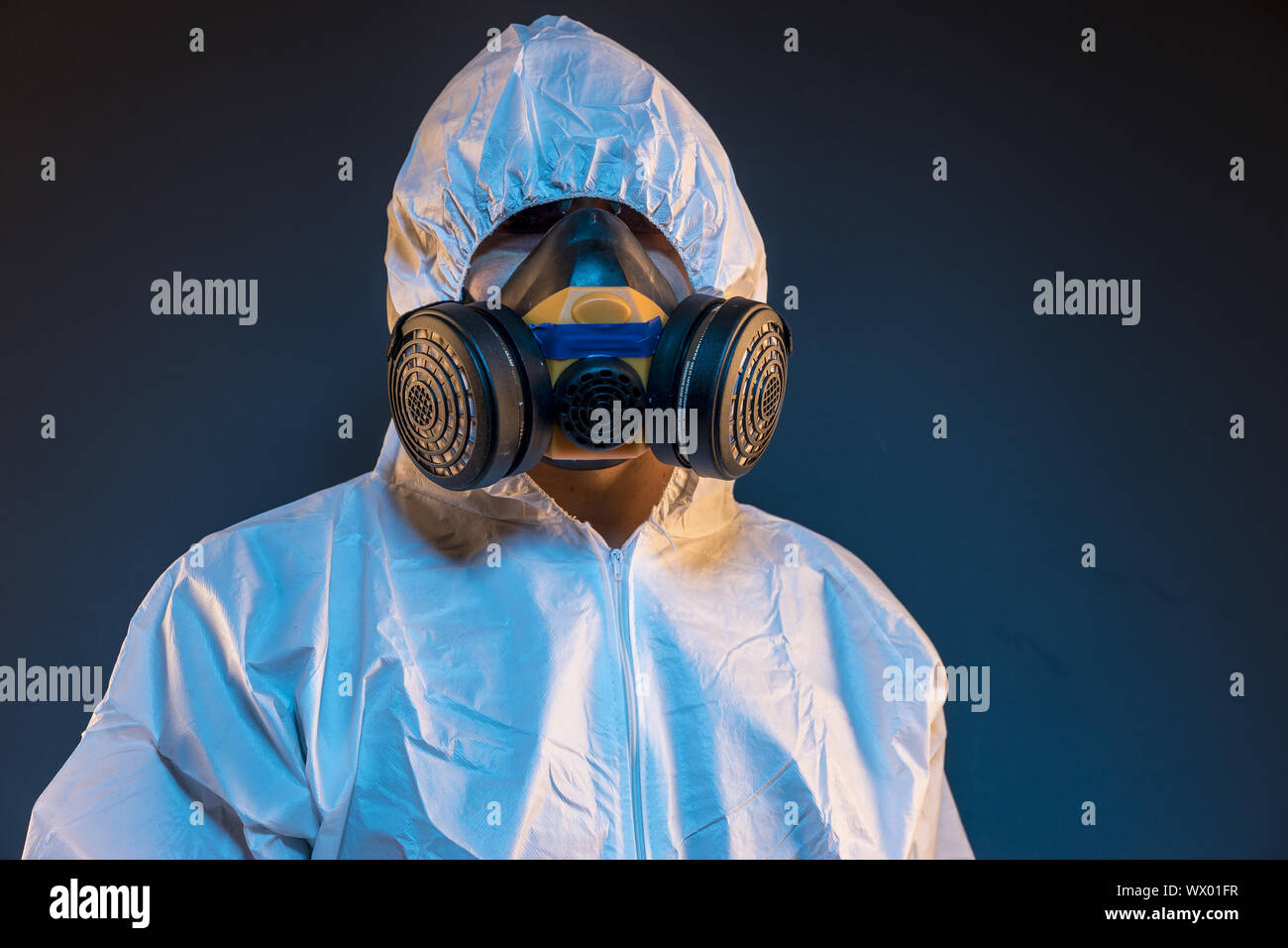 virus infection concept. Man in protective suit and antigas mask with ...