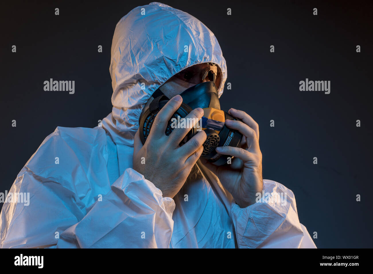 virus infection concept. Man in protective suit and antigas mask with ...