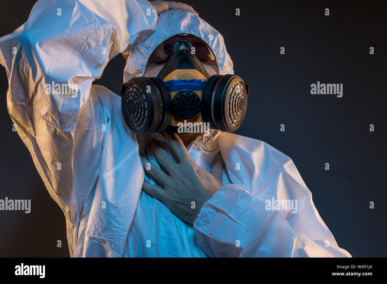 virus infection concept. Man in protective suit and antigas mask with ...