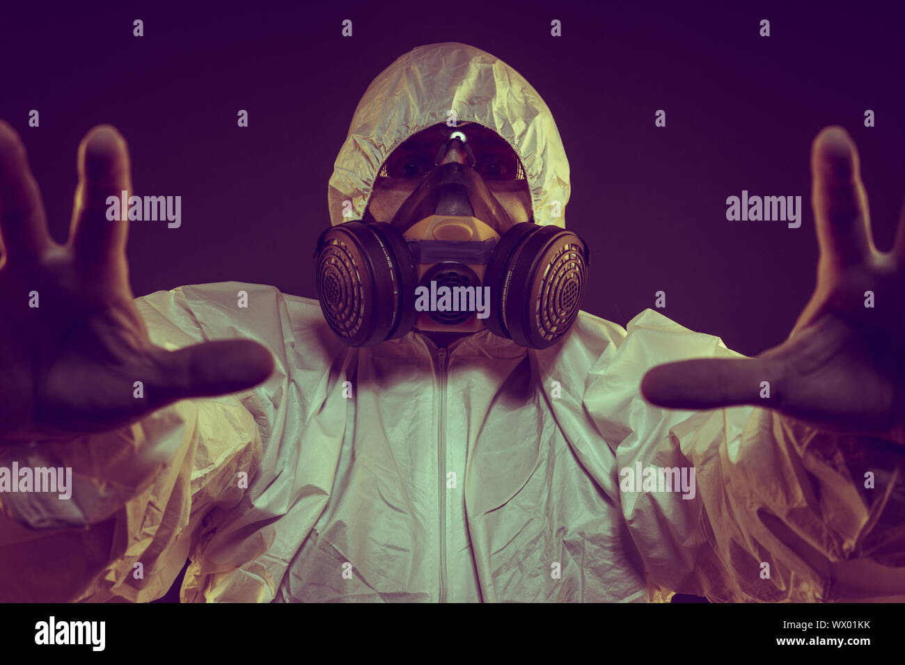 virus infection concept. Man in protective suit and antigas mask with ...