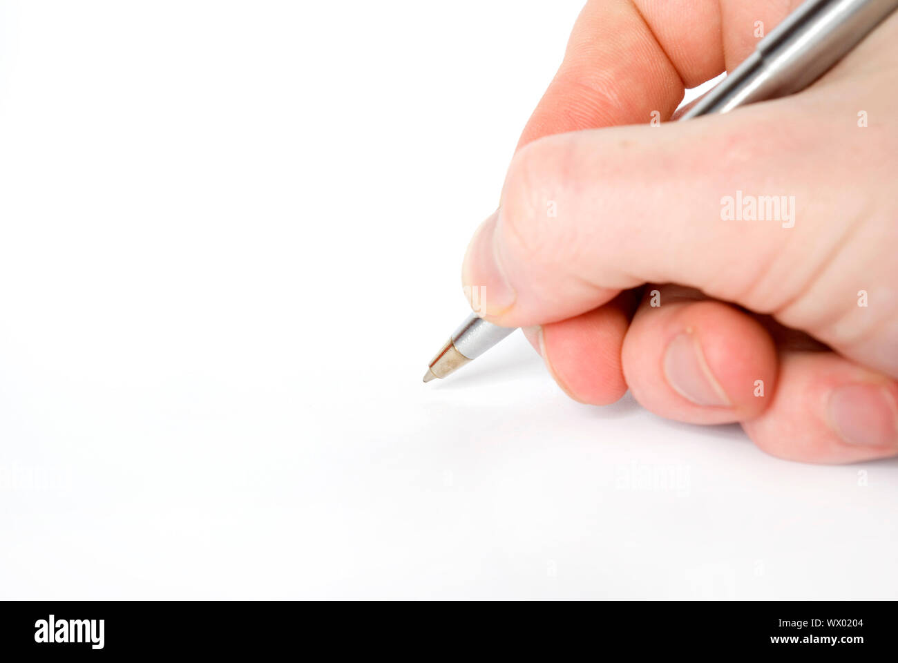 Hand holding pen isolated on white background Stock Photo - Alamy