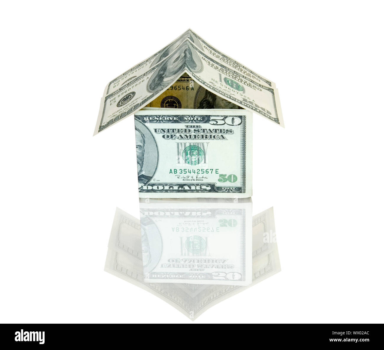Money house on white background Stock Photo - Alamy