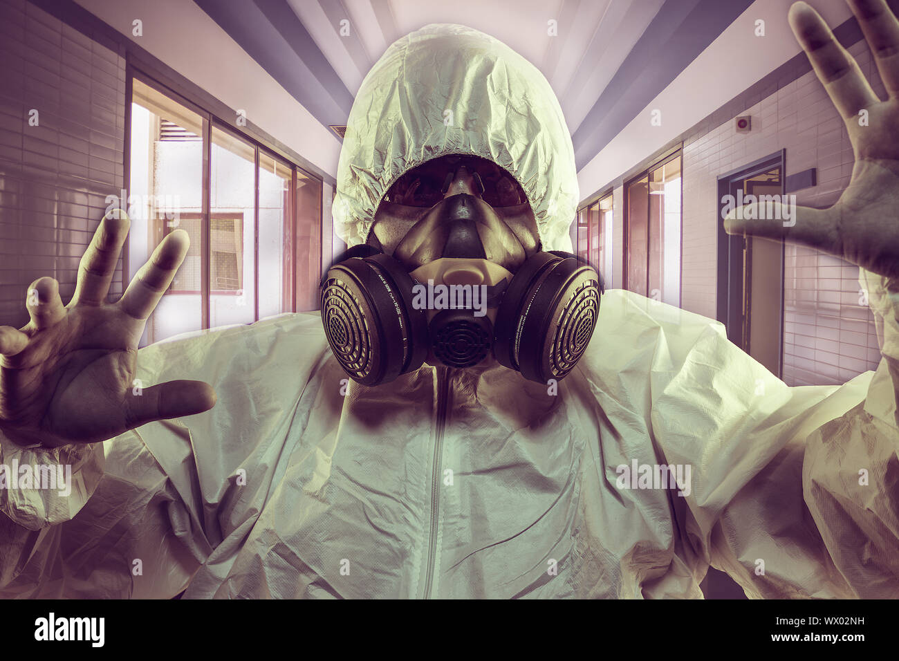 Safety virus infection concept. Man in protective suit and antigas mask ...