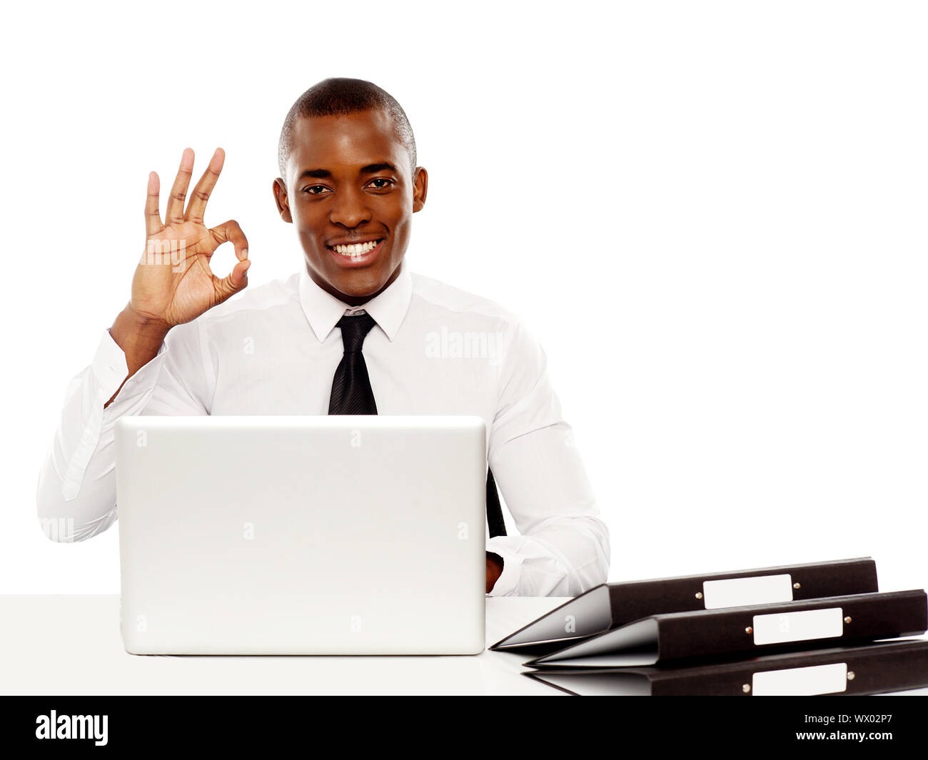 Smiling african male showing excellent symbol to camera isolated ...