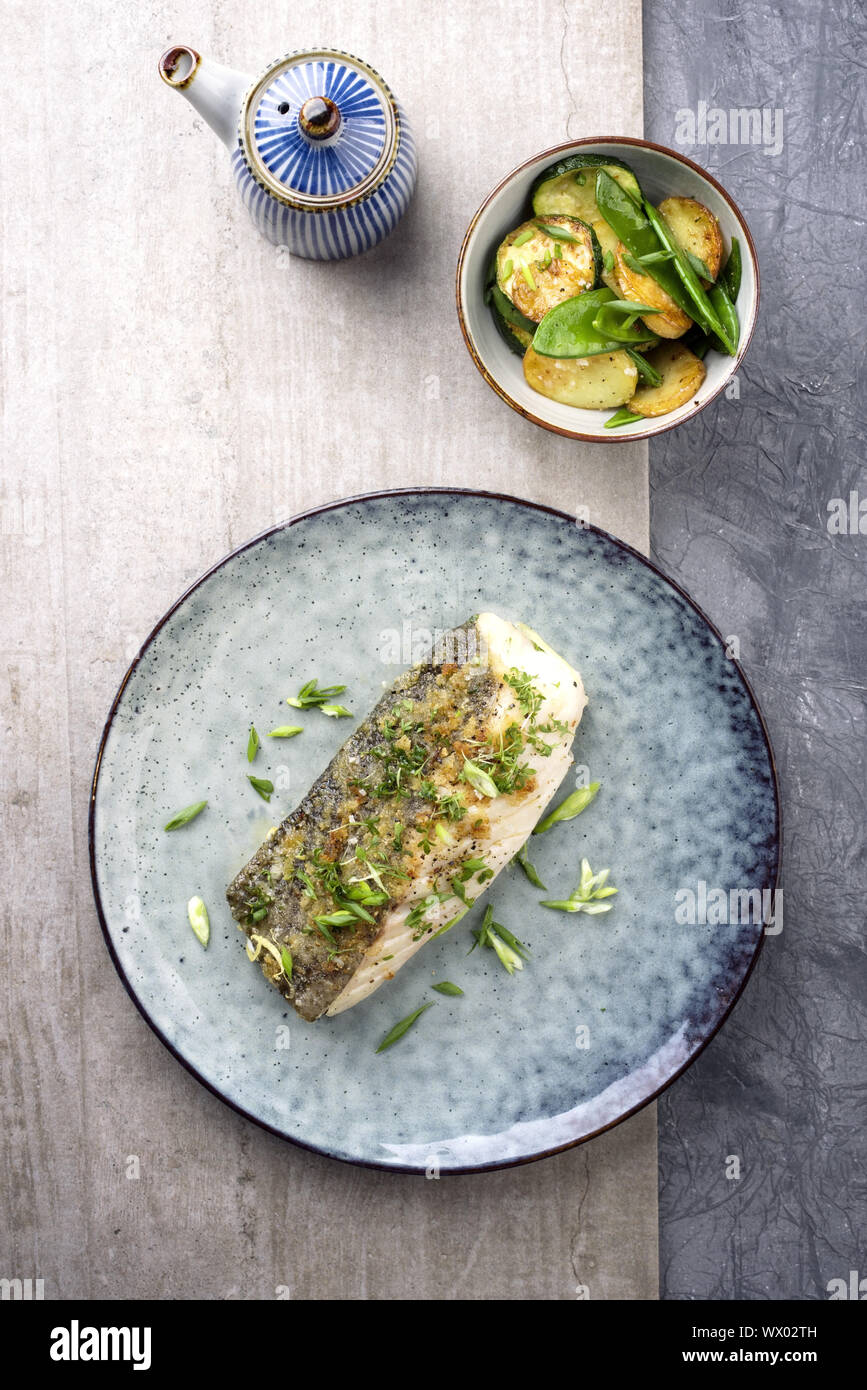 Japanese Fried cod fish fillet with vegetable and potatoes as top-view ...