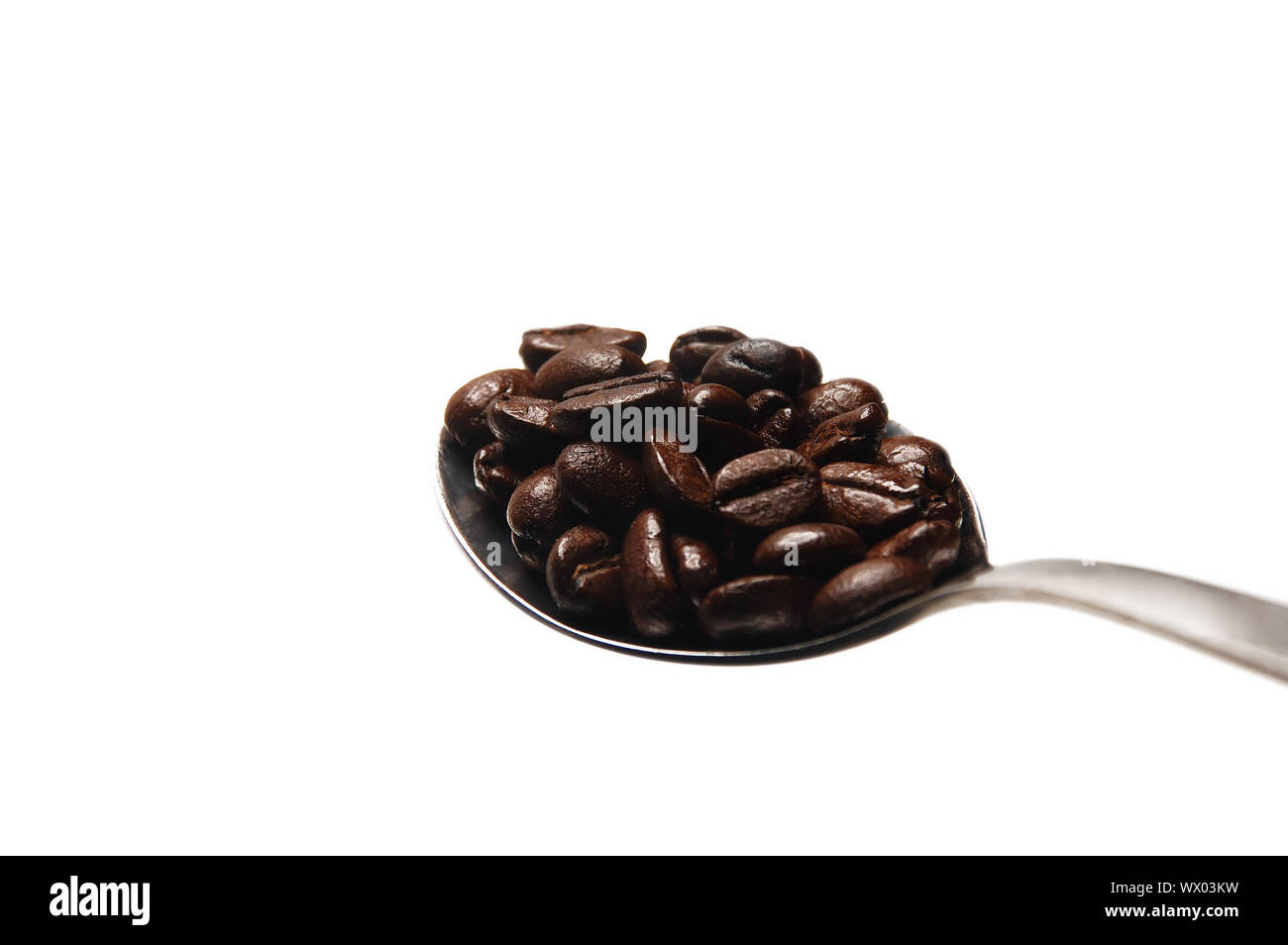coffee beans on spoon Stock Photo - Alamy