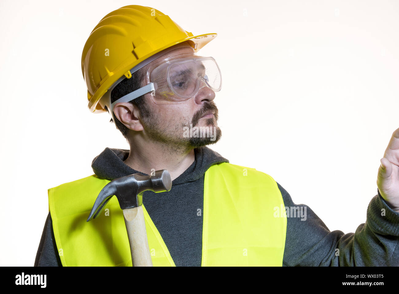 Do it yourself, man dressed in yellow builder helmet with protective ...