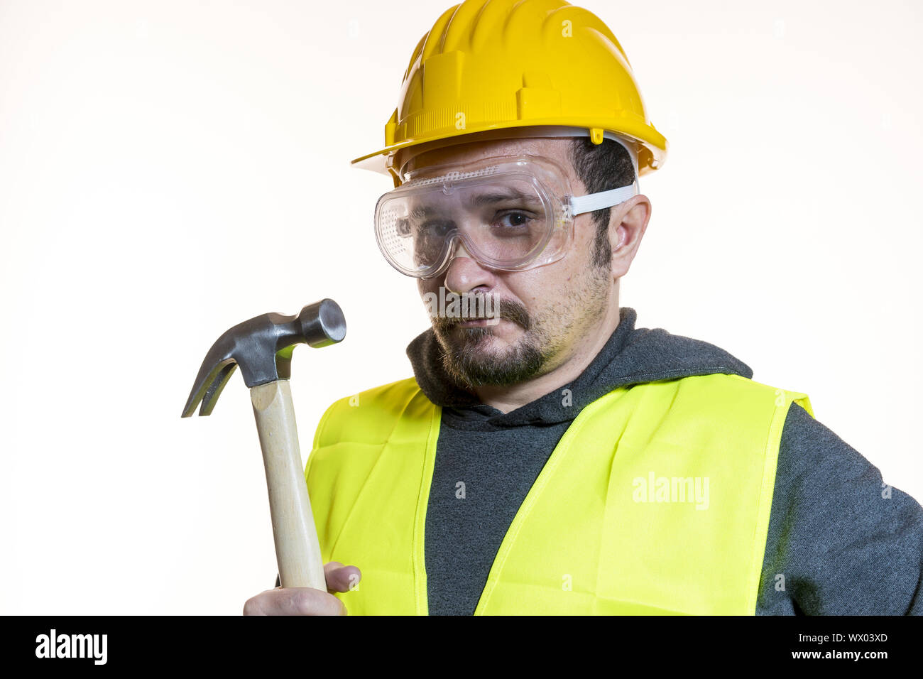 Do it yourself, man dressed in yellow builder helmet with protective ...