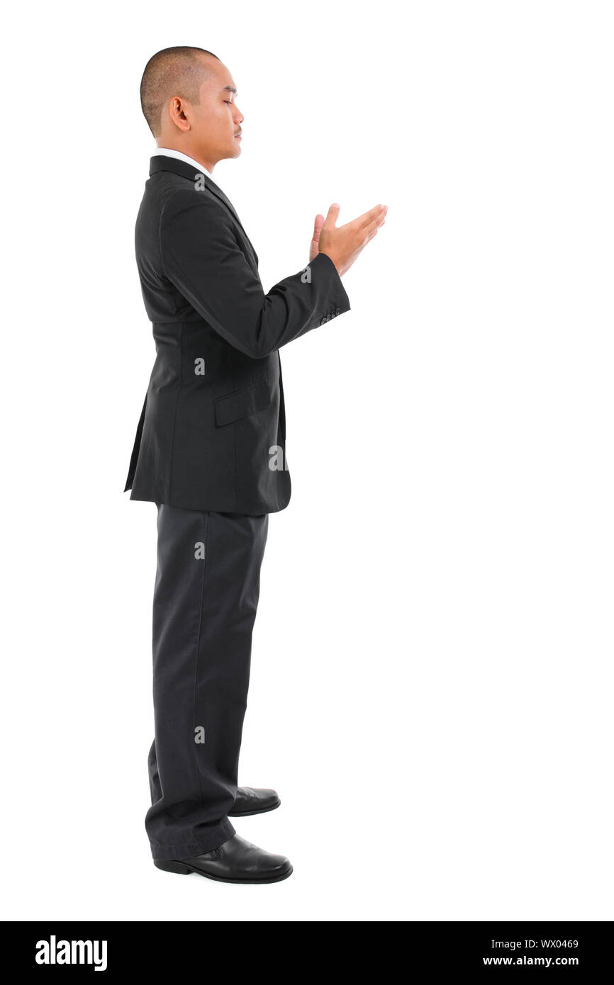 Male Muslim prayer in full business suit praying over white background ...