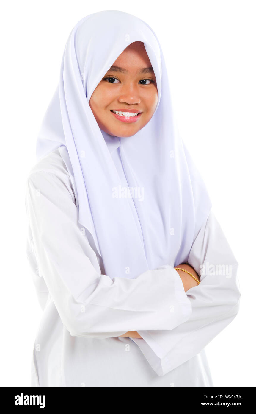 Portrait of a Southeast Asian Muslim teen crossed arms over white ...